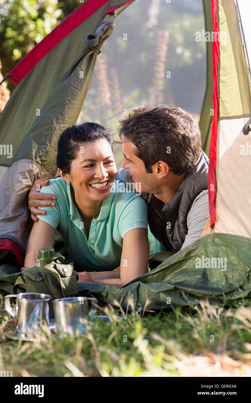 Couple laying and holding each other Stock Photo - Alamy