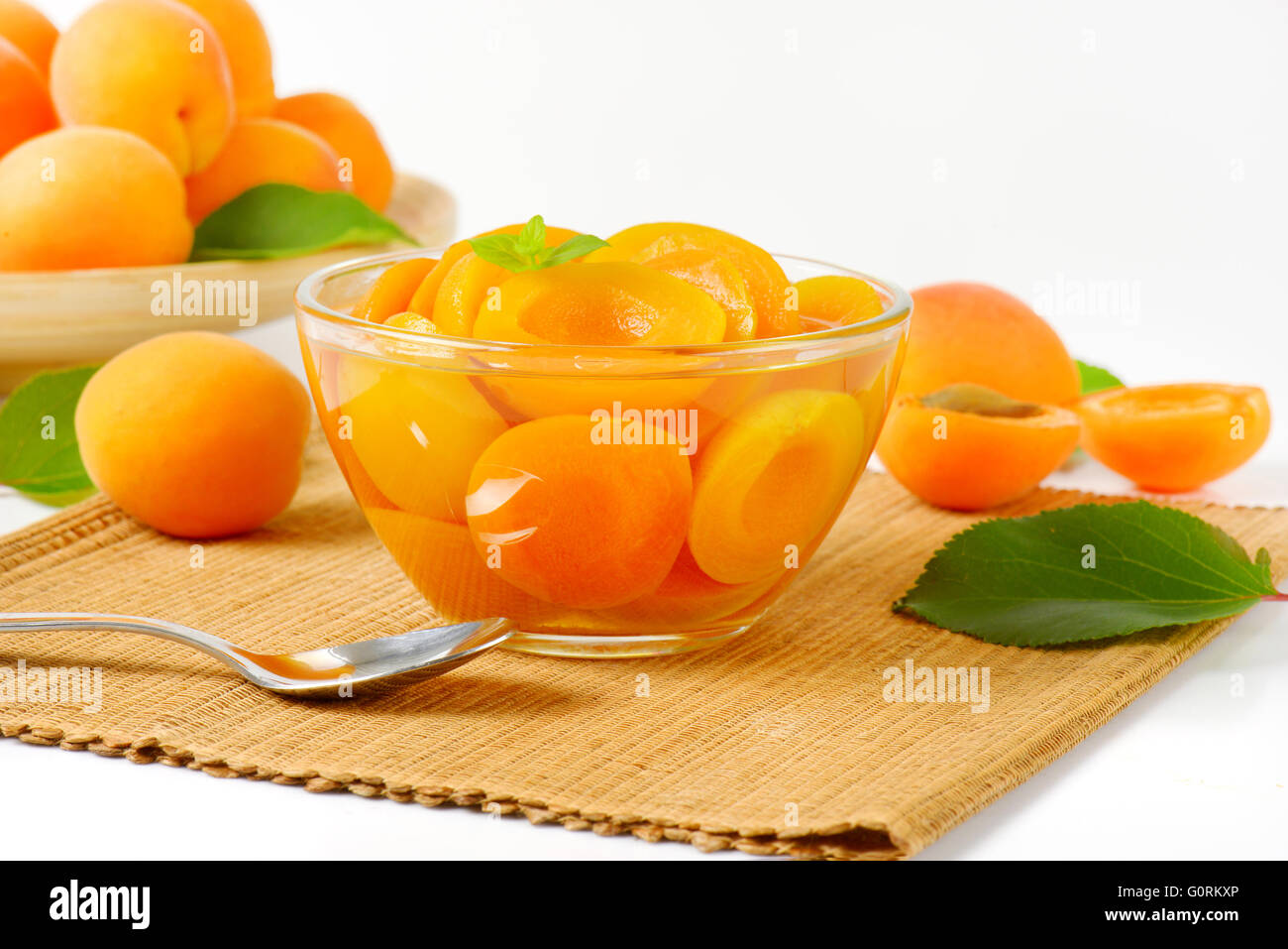 Compote made of halved apricots in light syrup Stock Photo - Alamy
