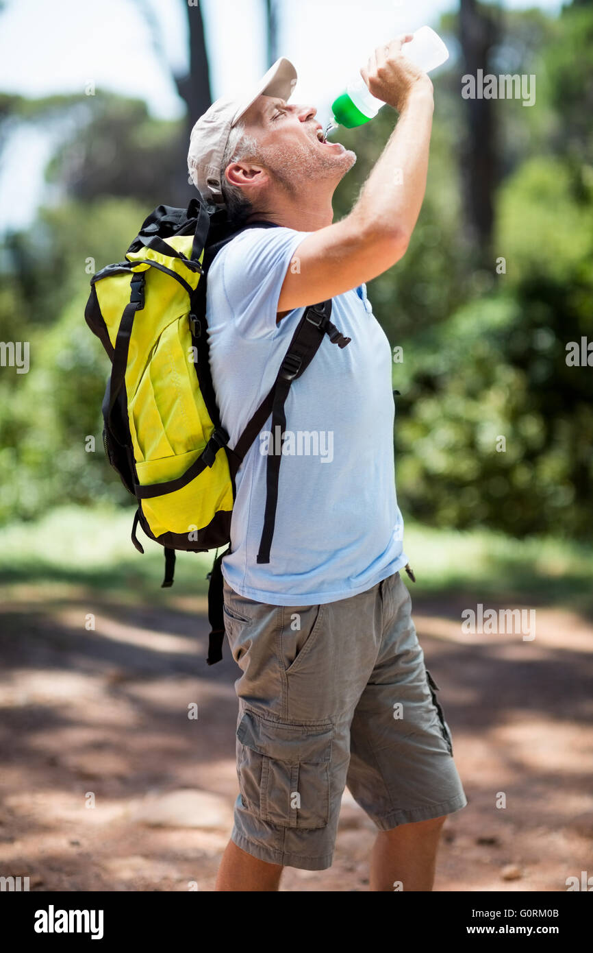 Man drinking with his flask Stock Photo - Alamy