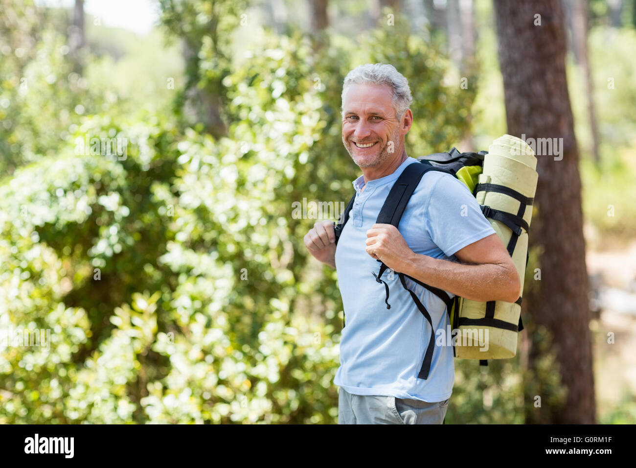 Man smiling and hiking Stock Photo - Alamy