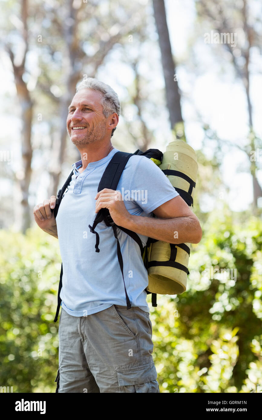 Man smiling and posing with his backpack Stock Photo - Alamy