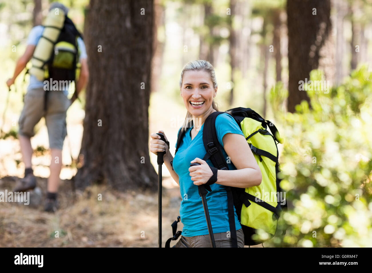 Woman smiling and hiking Stock Photo - Alamy