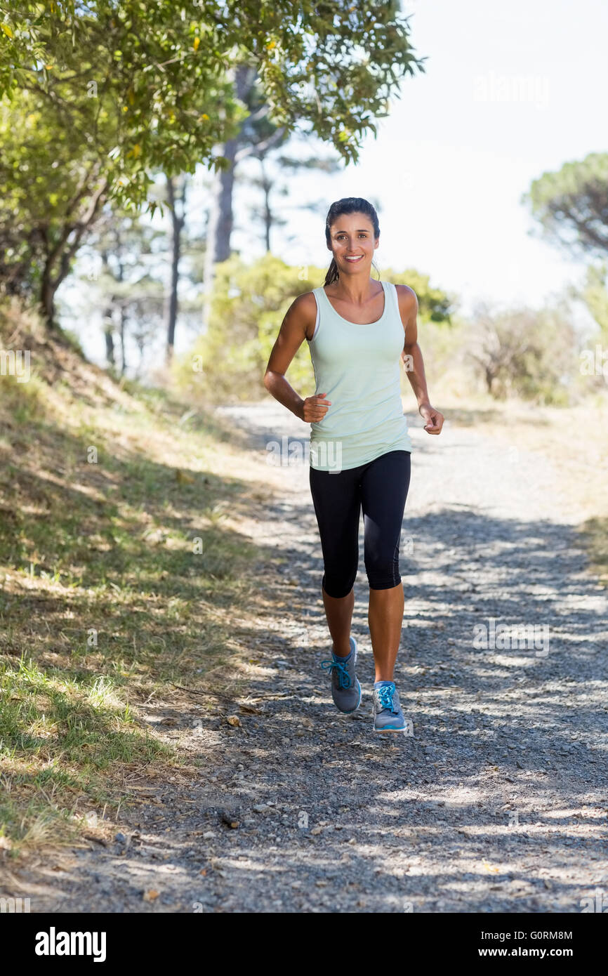 Woman smiling and running Stock Photo - Alamy