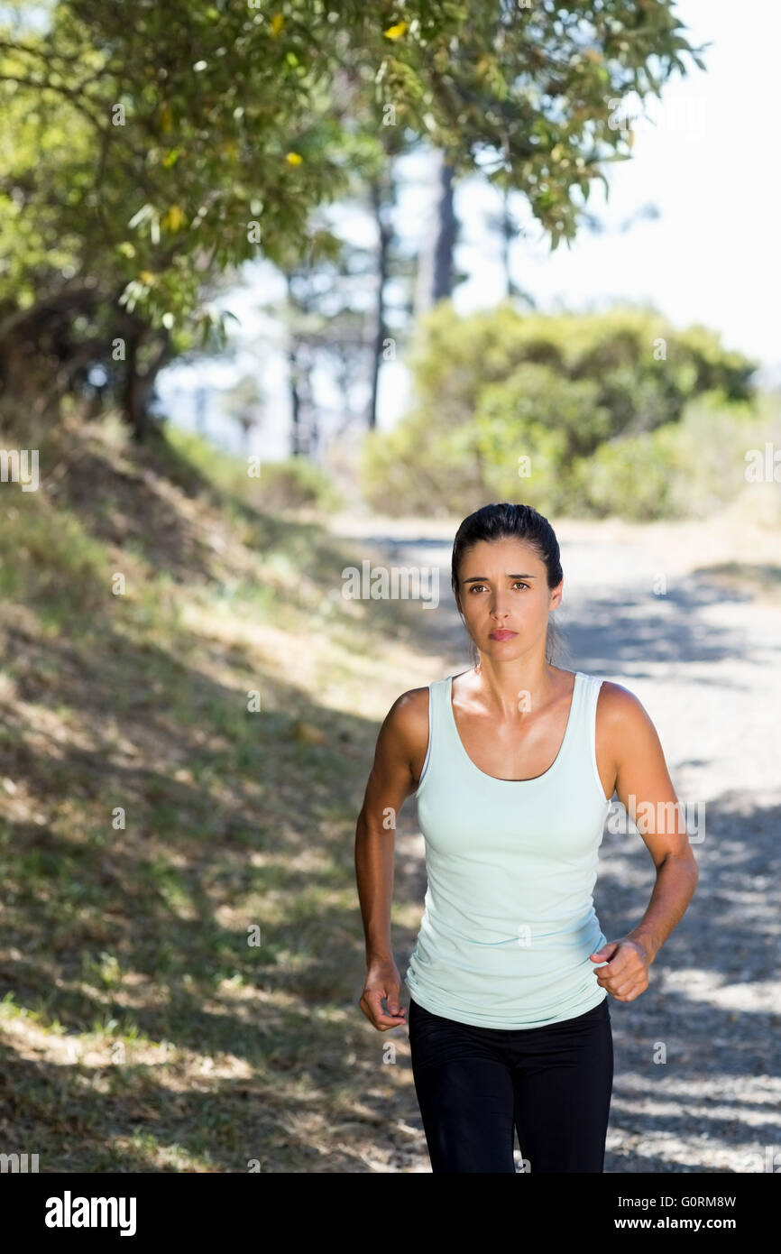 Front view of woman jogging Stock Photo - Alamy