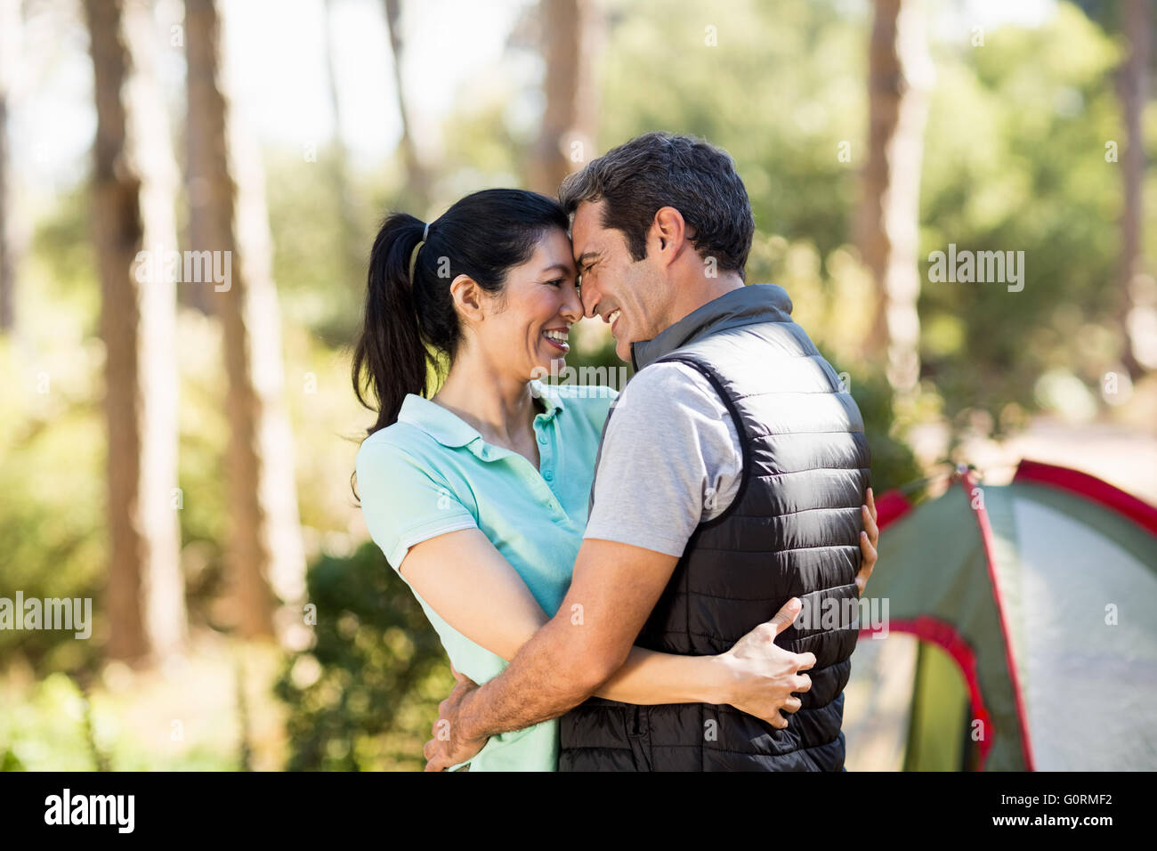 Couple smiling and holding each other Stock Photo - Alamy