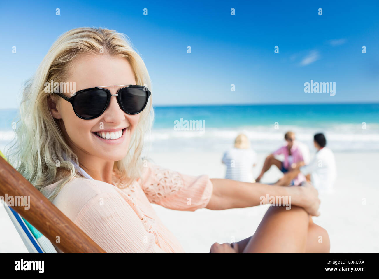 Woman lying on the beach Stock Photo - Alamy