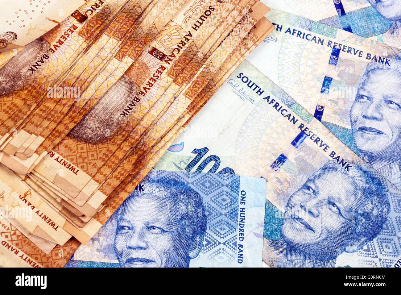 Closeup scattered collection of used South African twenty and fifty ...