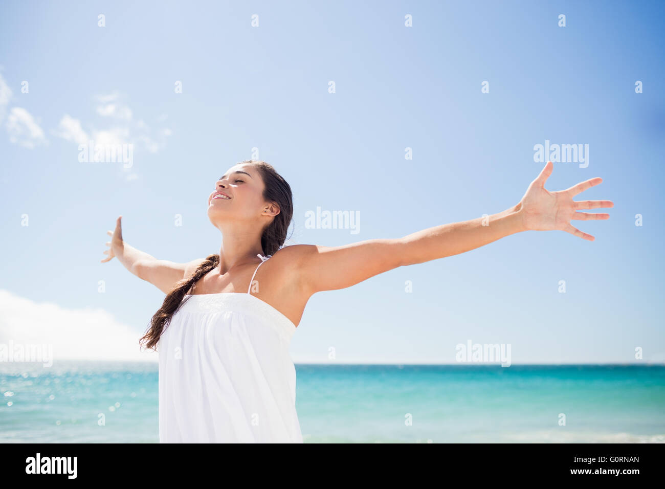 Portrait of smiling woman on the beach Stock Photo - Alamy