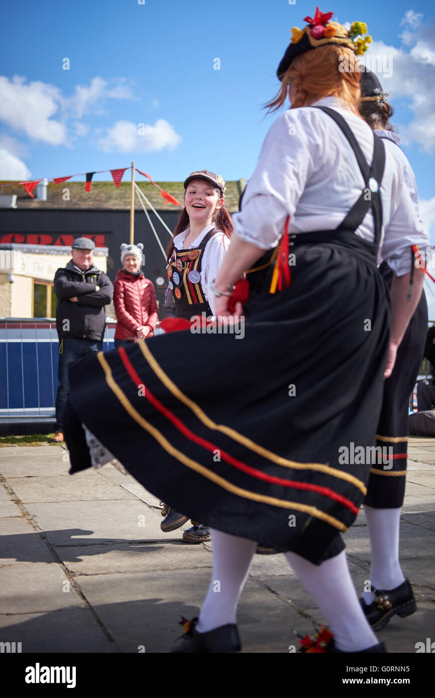 Three women in a morris dancing troop showing flowing dresses on a ...