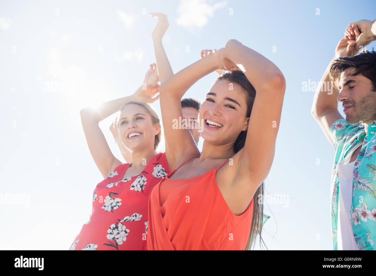 Friends dancing at the beach Stock Photo - Alamy