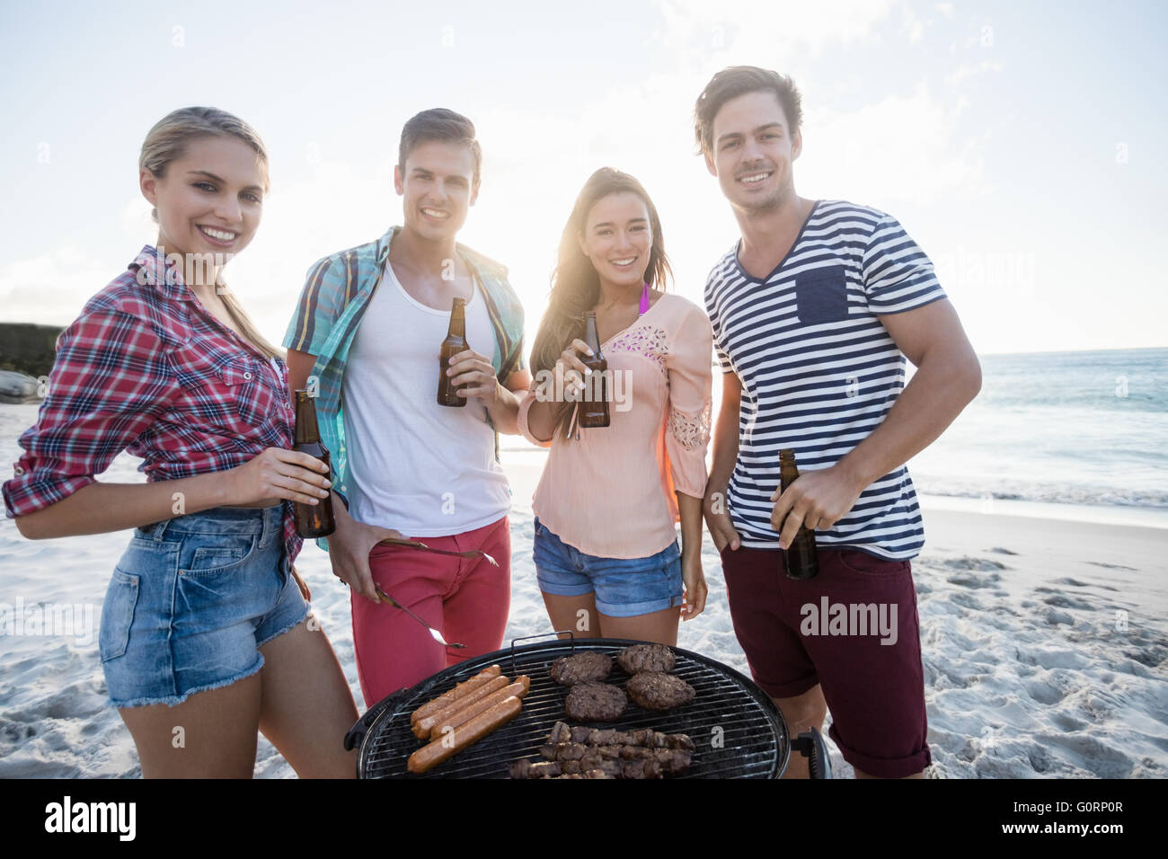 Friends having a barbecue Stock Photo - Alamy