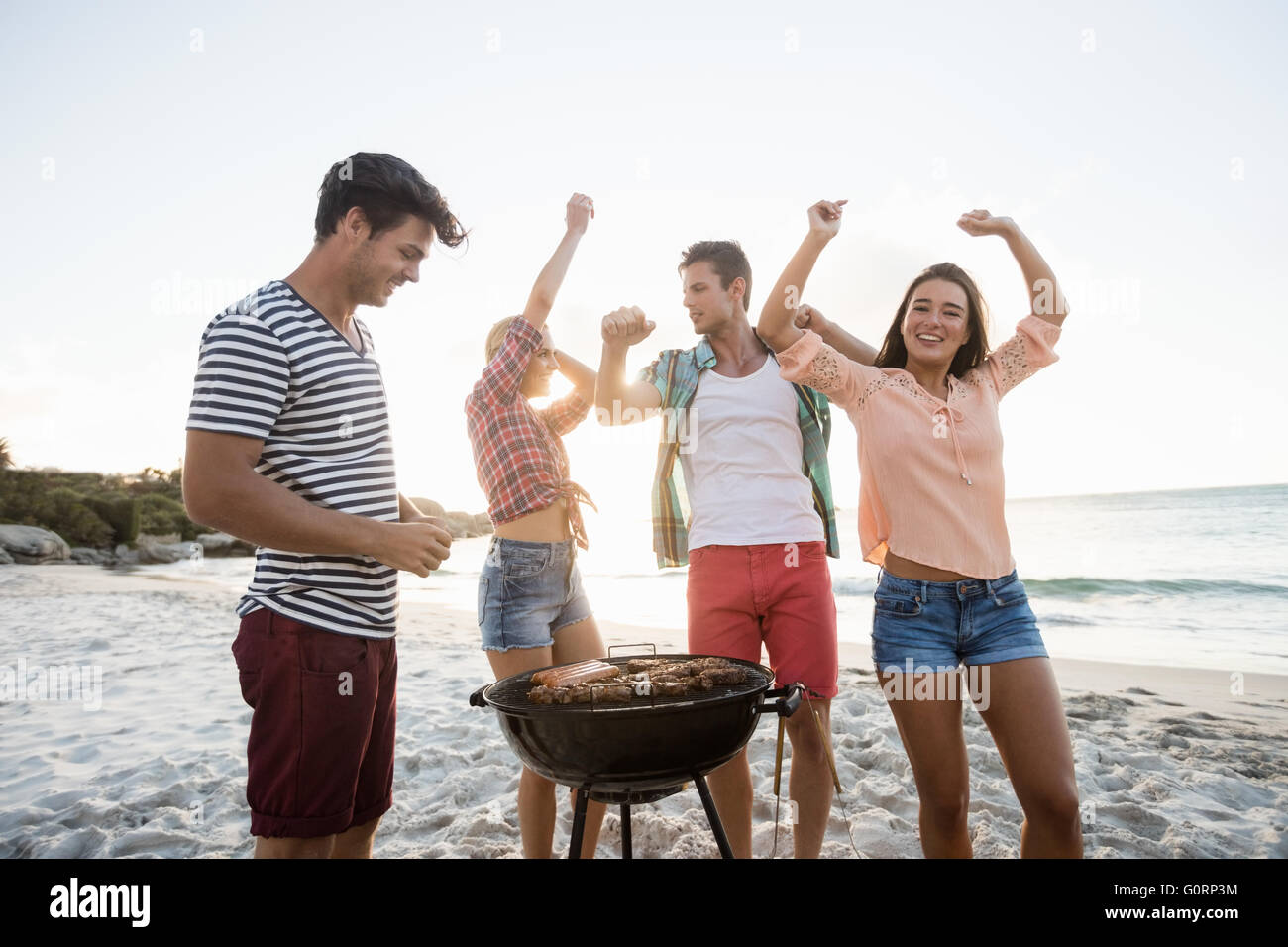 Friends having a barbecue Stock Photo - Alamy