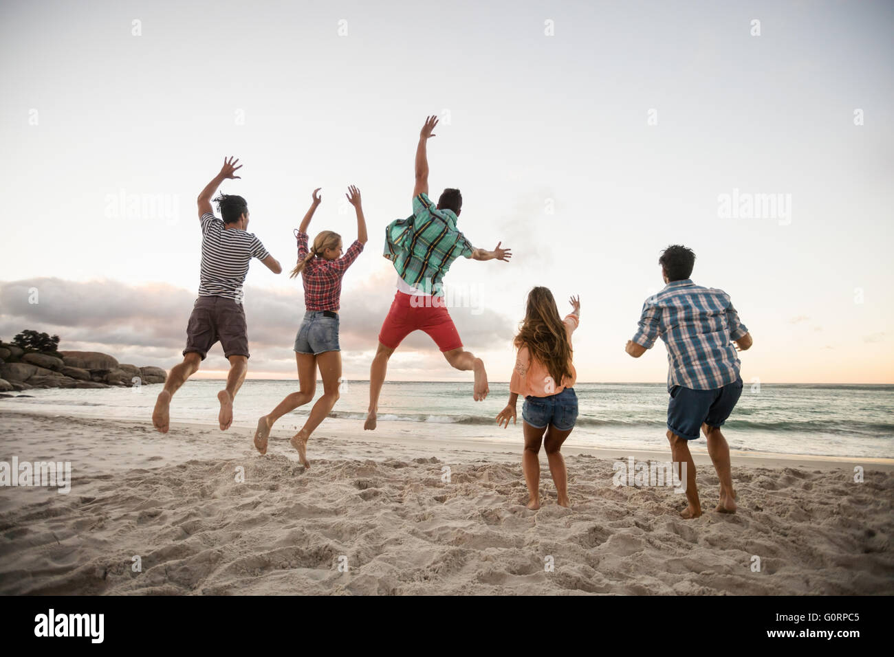 Jumping friends hi-res stock photography and images - Alamy