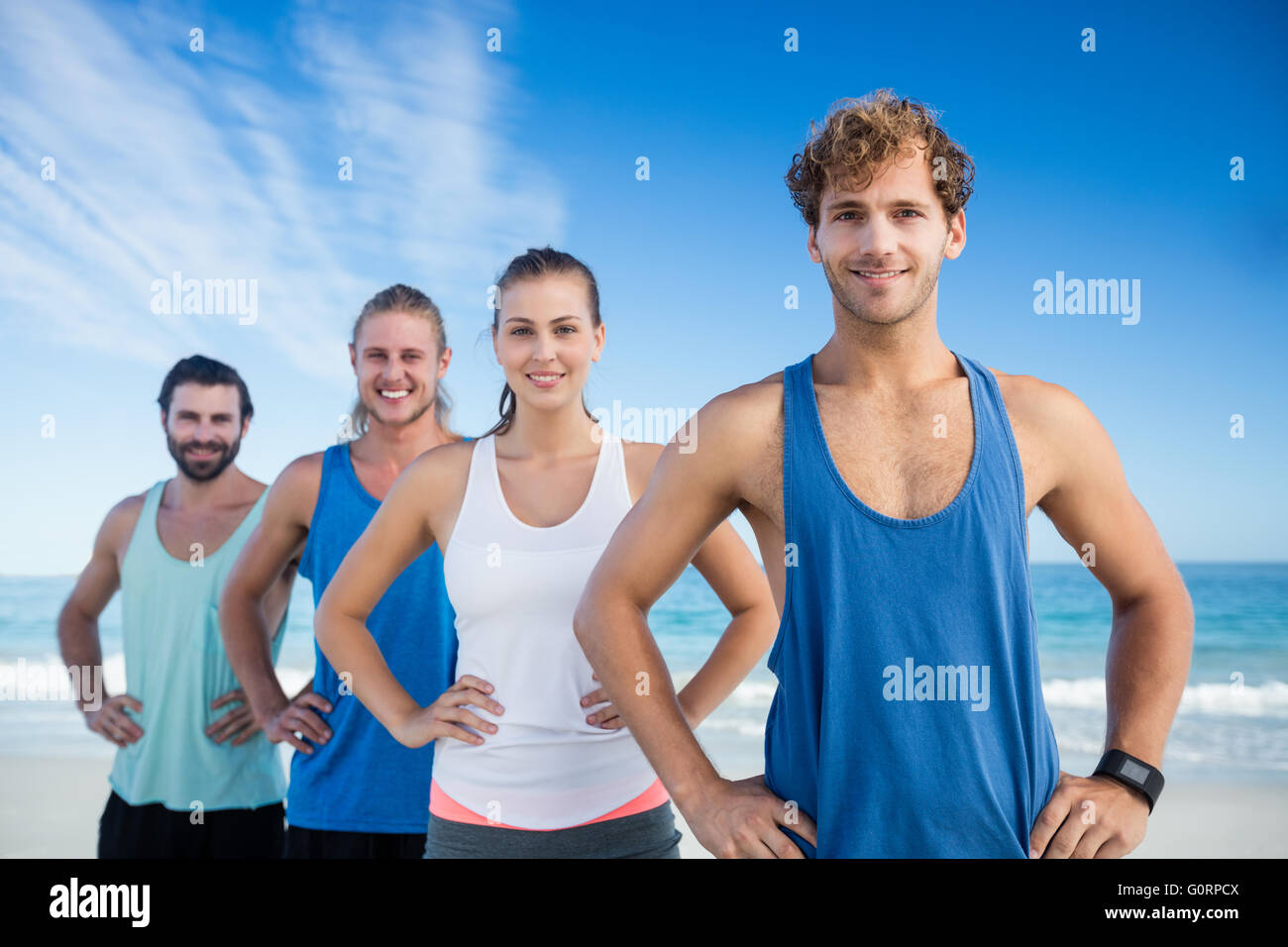 Friends standing in a row Stock Photo - Alamy