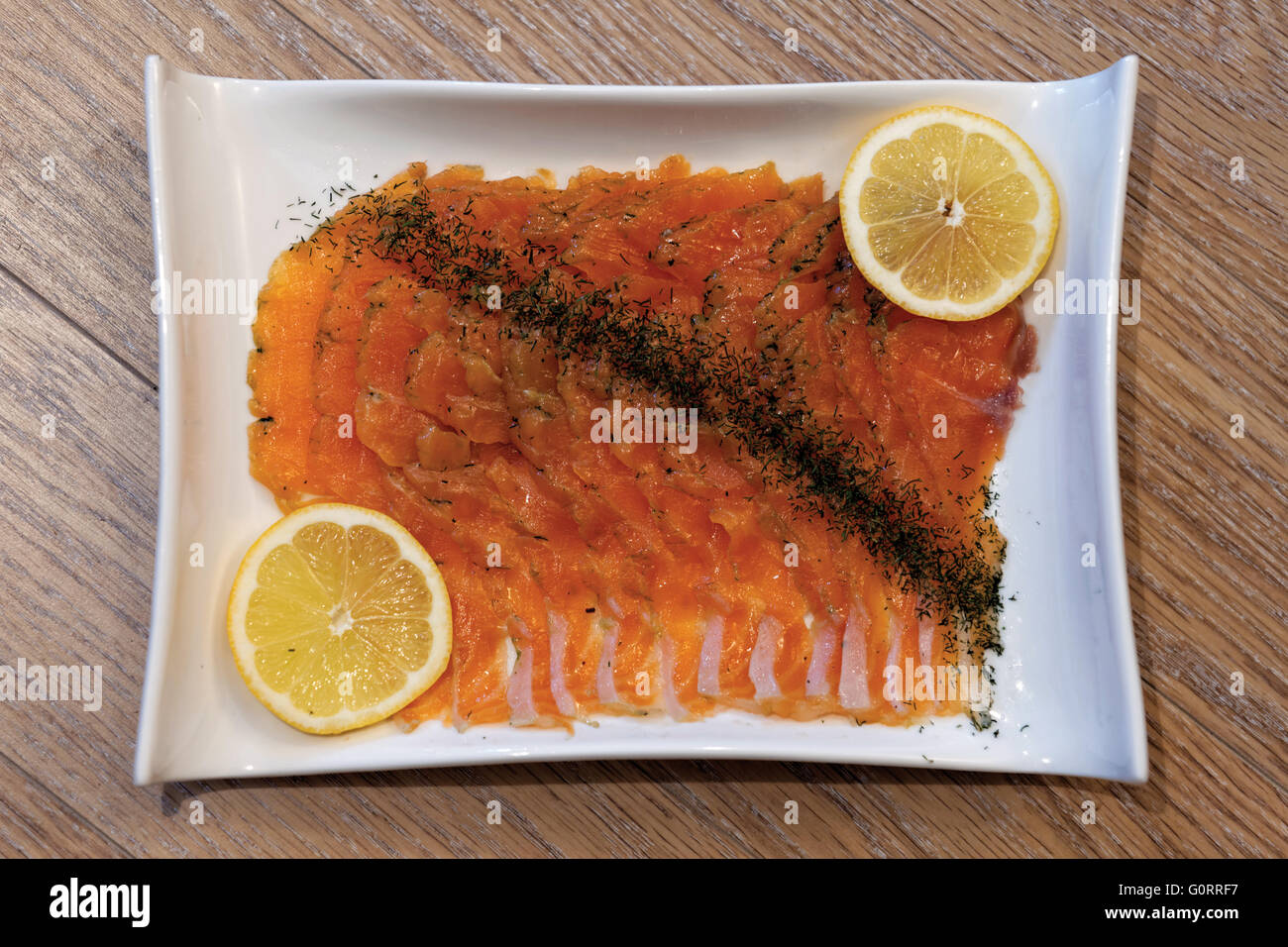 Gravlax on white plate Stock Photo - Alamy