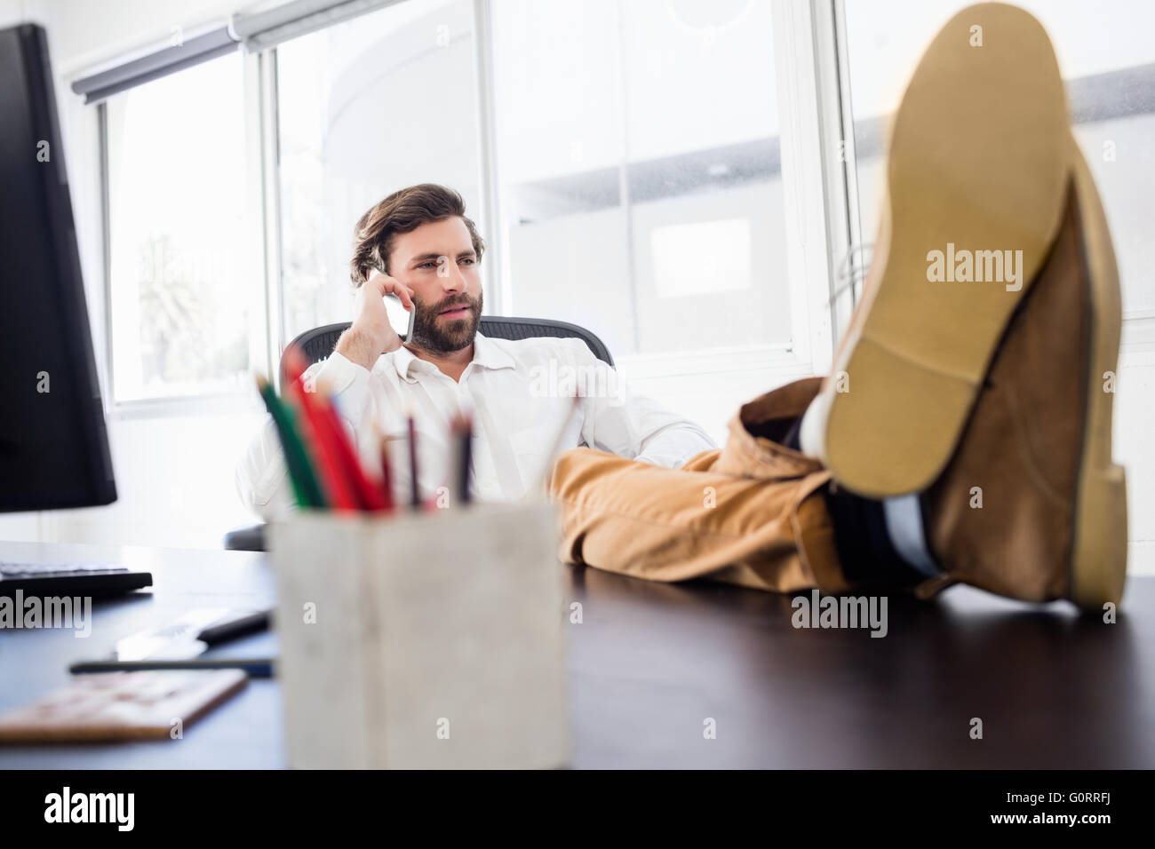 A man calling in the office Stock Photo - Alamy