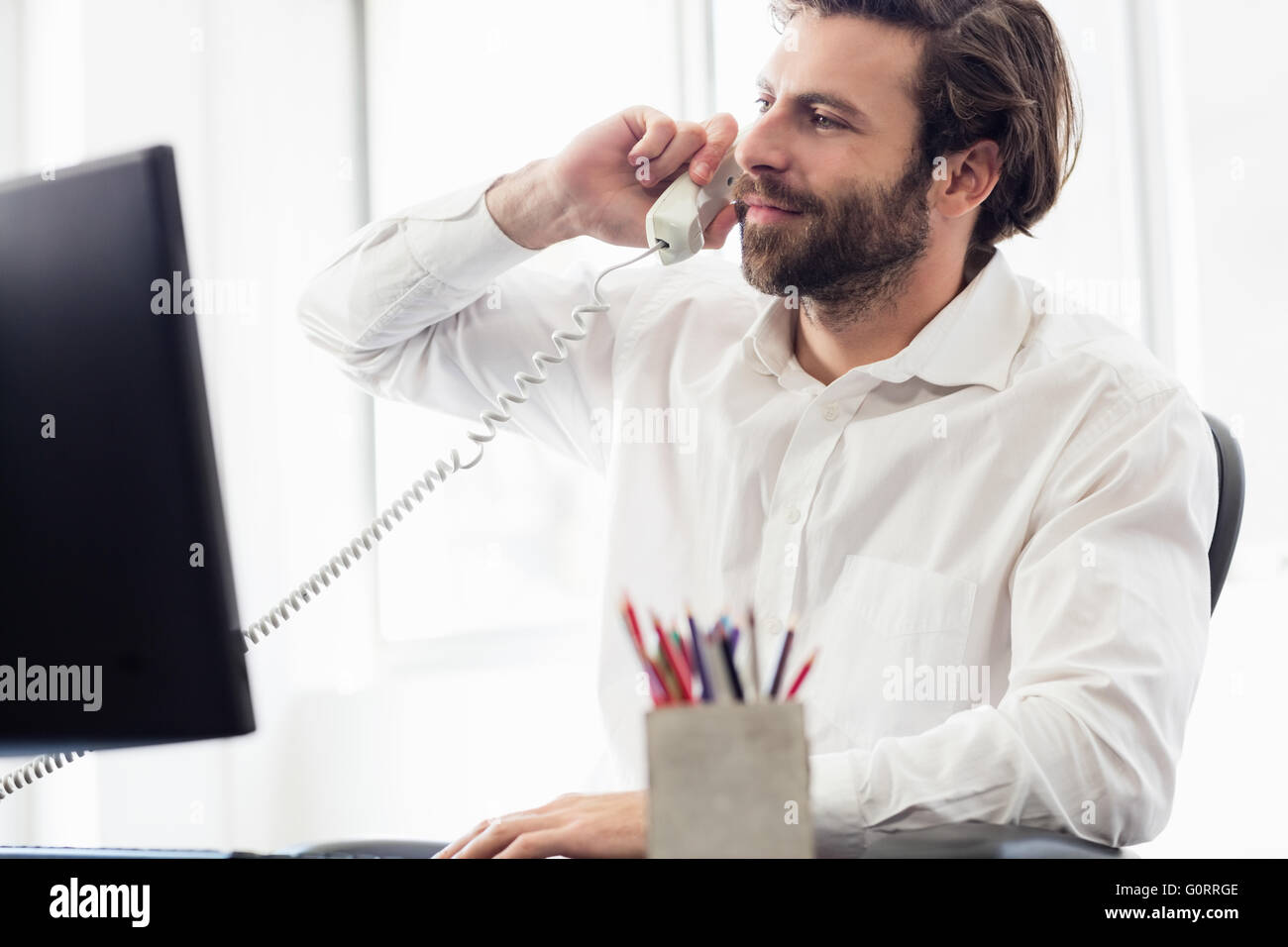 Passing the phone hi-res stock photography and images - Alamy