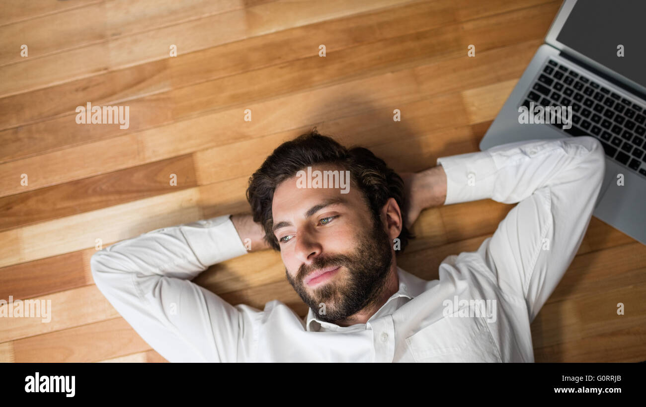 Man lying on the floor Stock Photo - Alamy
