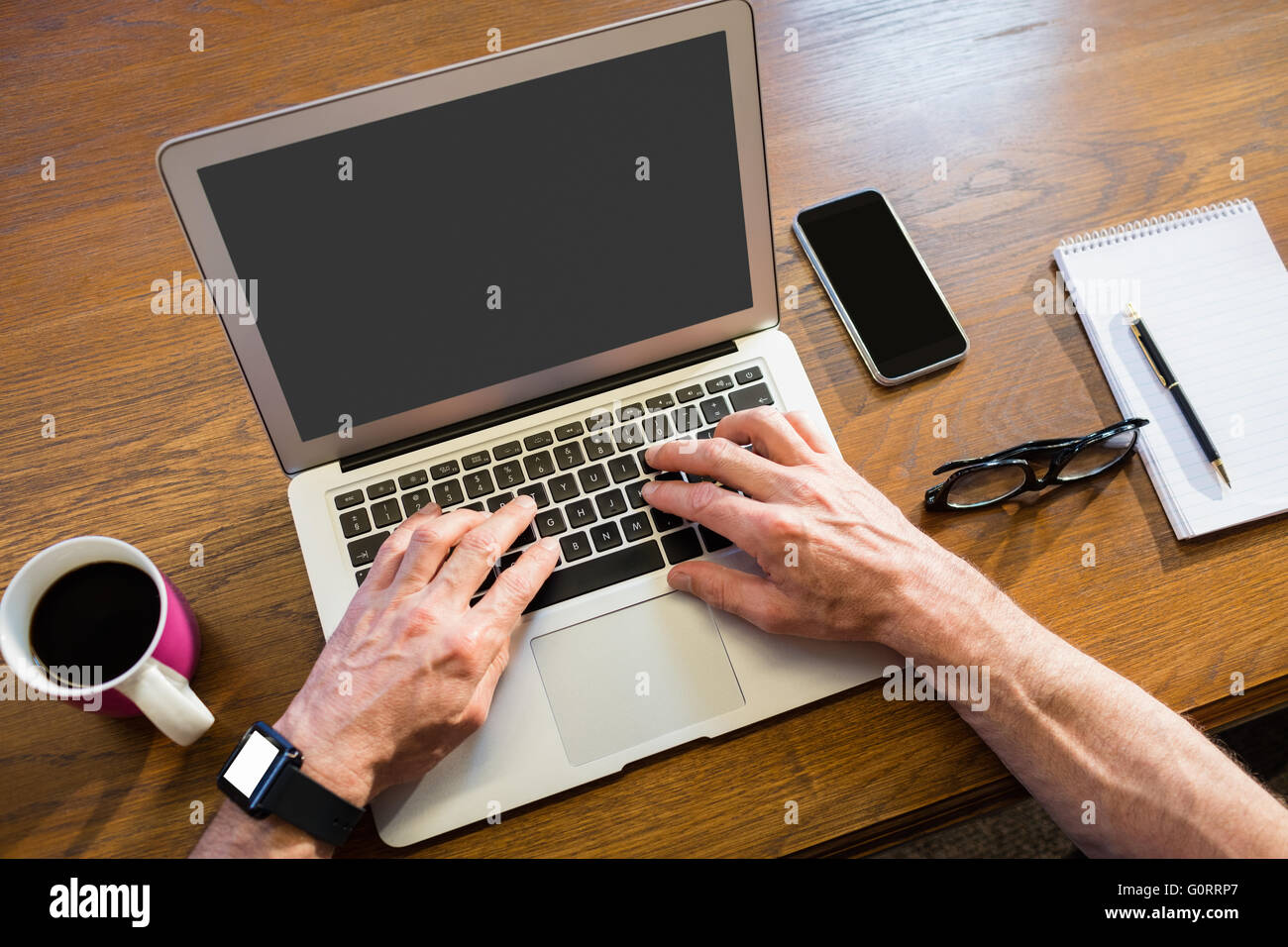 Businessman using a laptop Stock Photo - Alamy