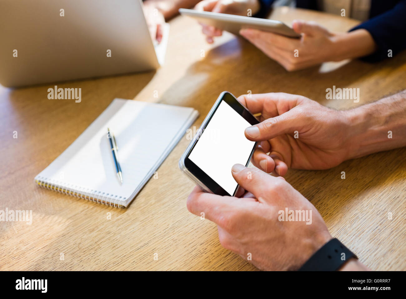 Colleagues using technology Stock Photo - Alamy