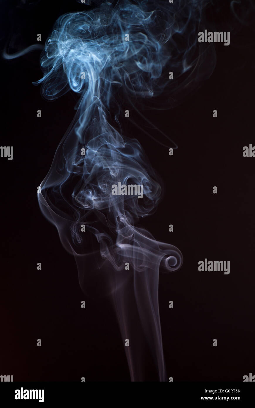 Beautiful smoke on the black background - macro photo Stock Photo - Alamy