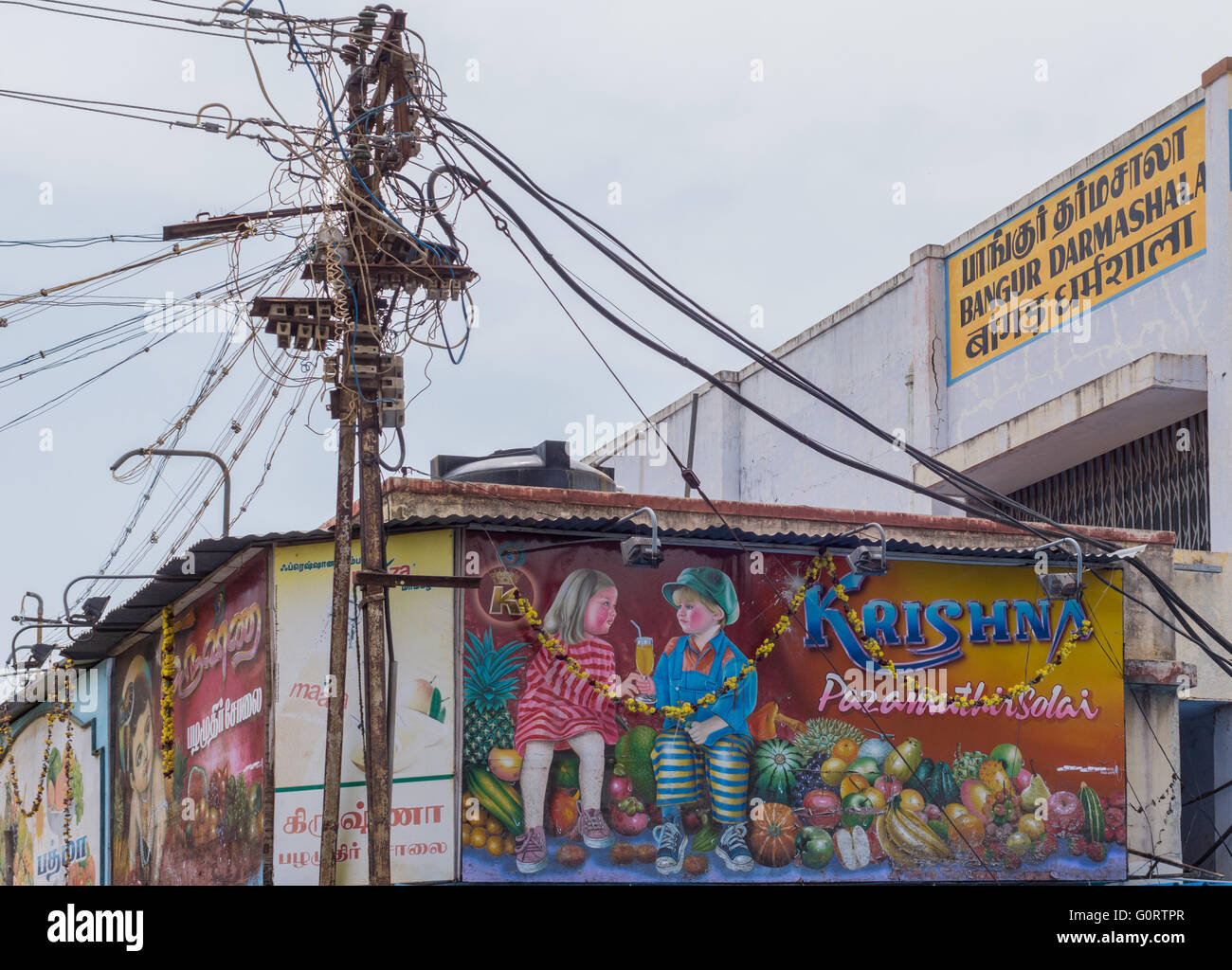 Two kids on billboard promote fruit business Stock Photo - Alamy