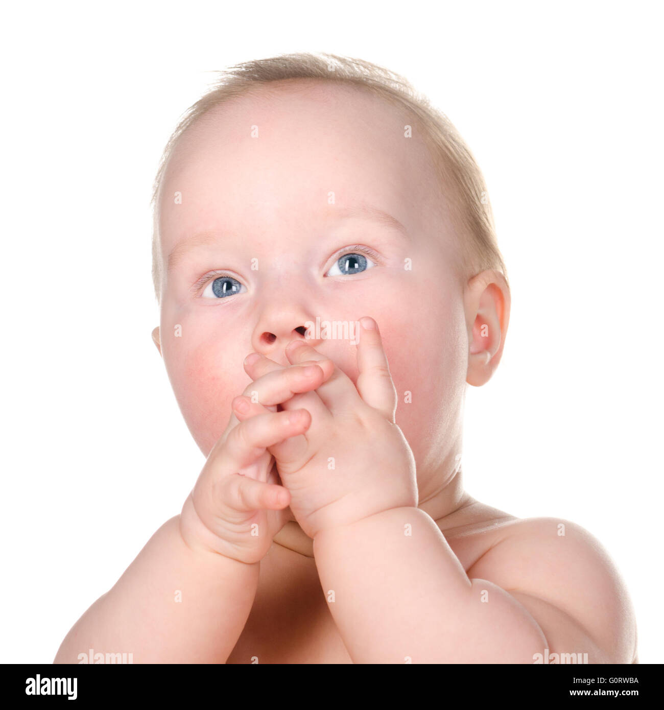 little baby is thoughtfully looking sideways Stock Photo - Alamy
