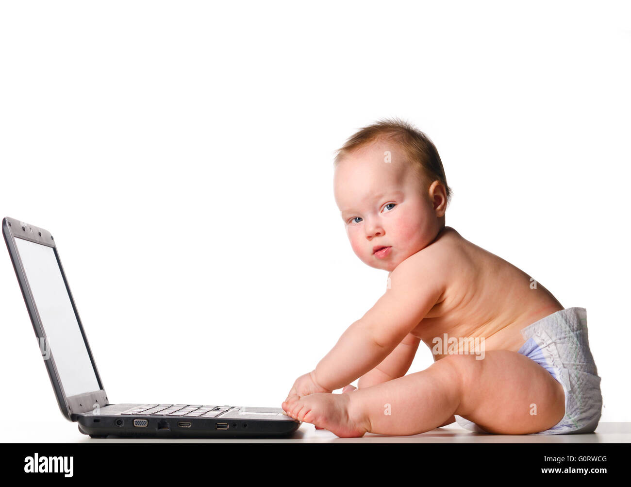 baby is working on laptop Stock Photo - Alamy
