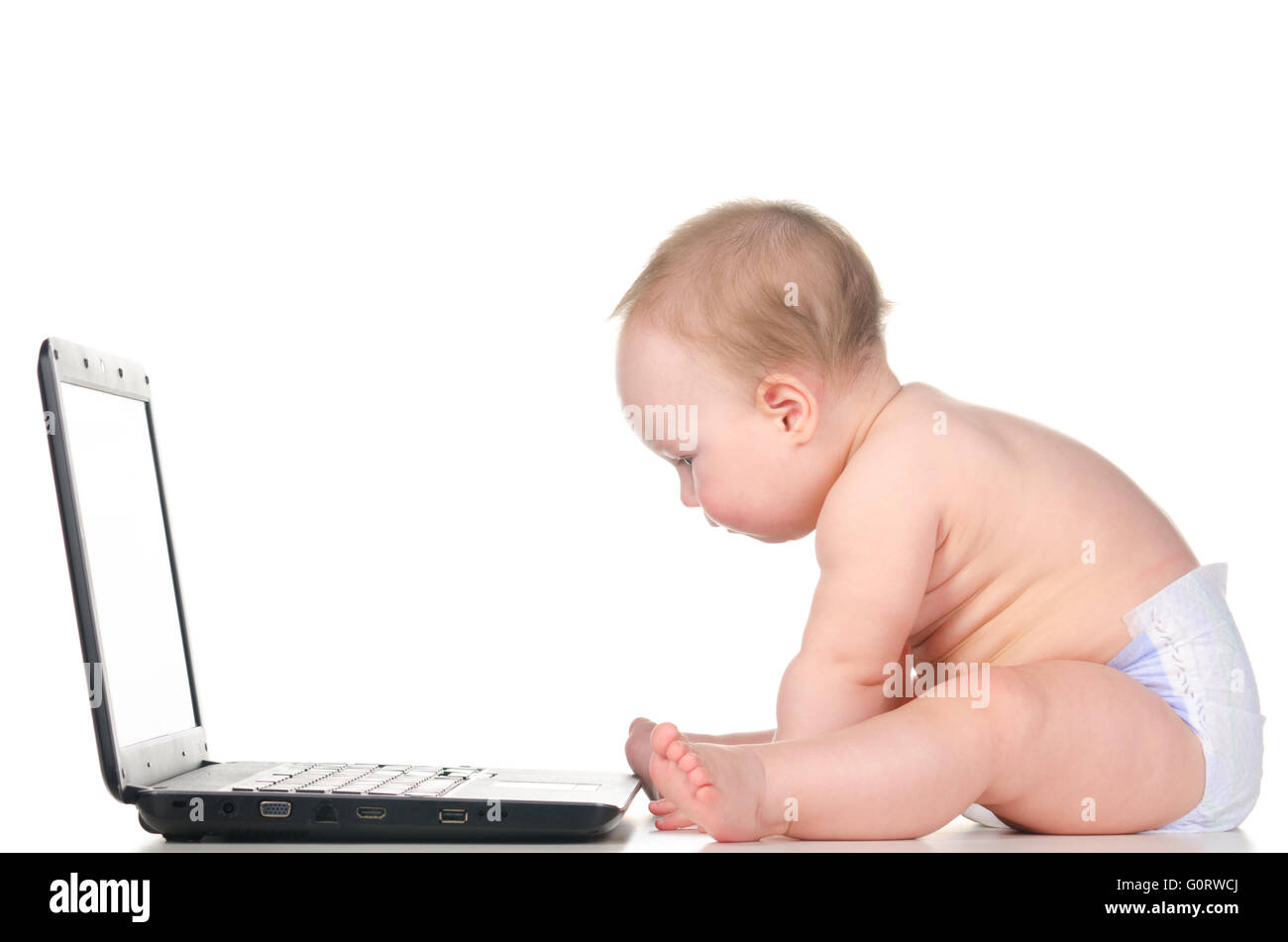 baby is working on laptop Stock Photo - Alamy