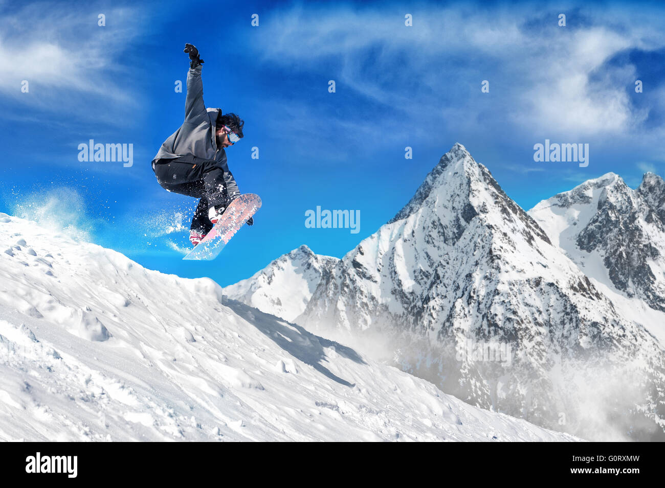 Extreme snowboarding man Stock Photo - Alamy