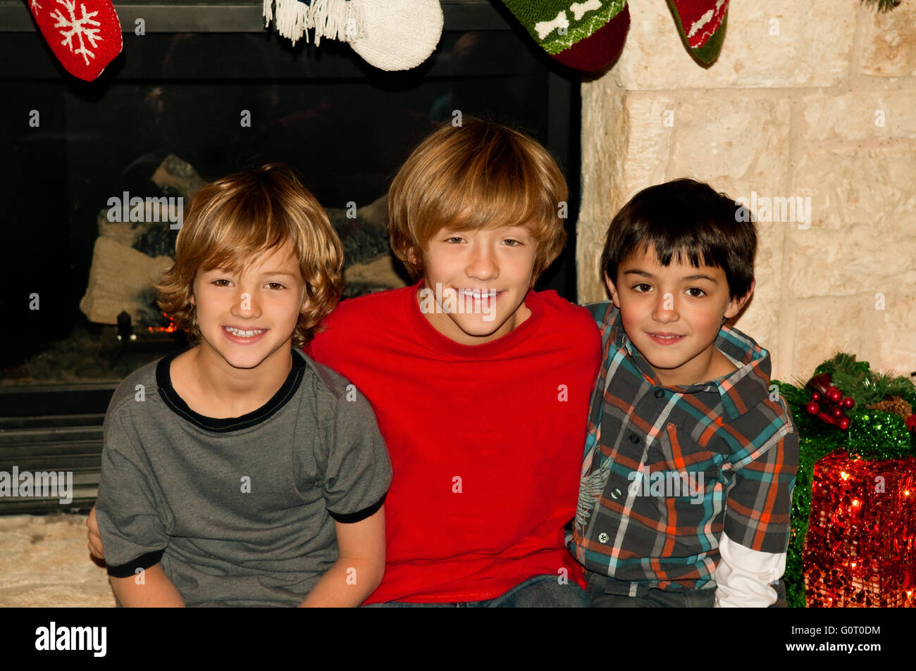 Cute three brothers christmas portrait hi-res stock photography and ...