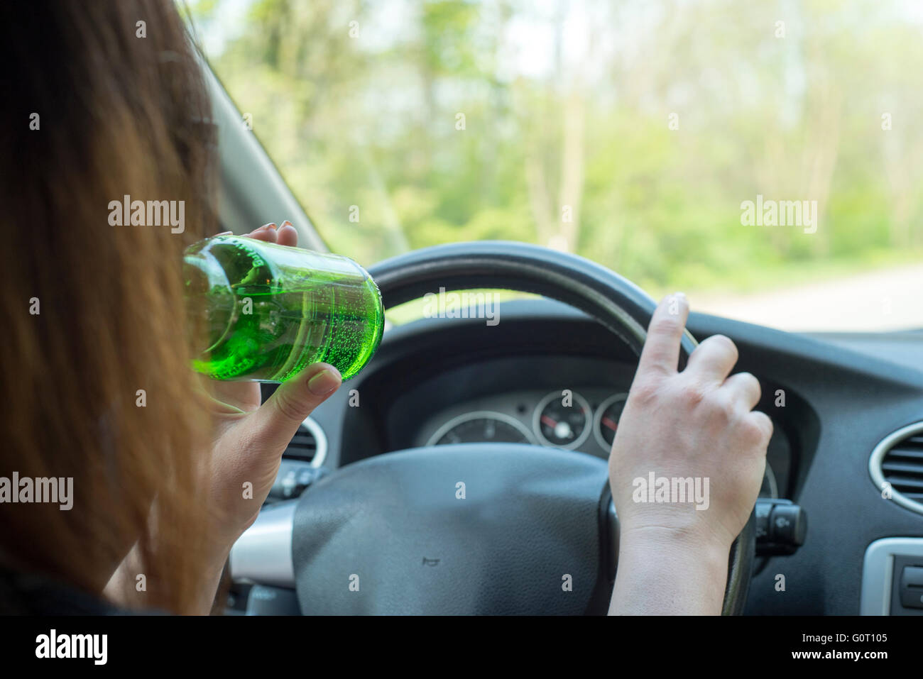picture of woman drinking alcohol in the car Stock Photo - Alamy