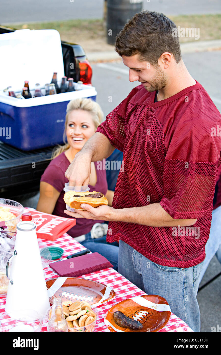 Series with college football fans tailgating and having fun before the ...