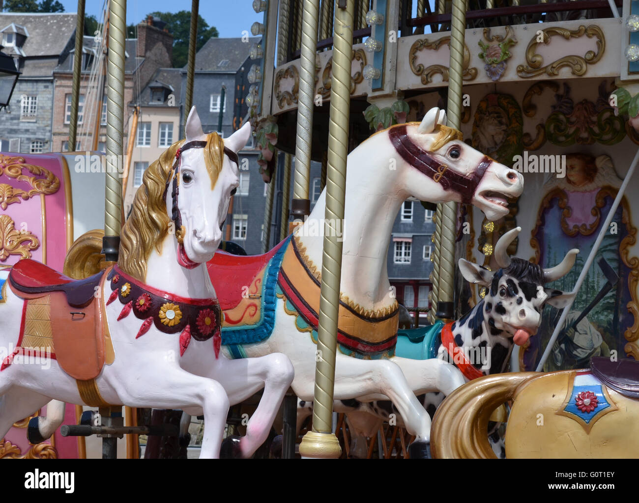 Carousel horses and cow Stock Photo - Alamy