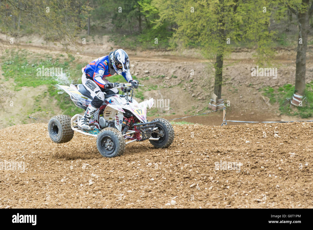 Quad rider is falling to the ground on the front wheels Stock Photo - Alamy