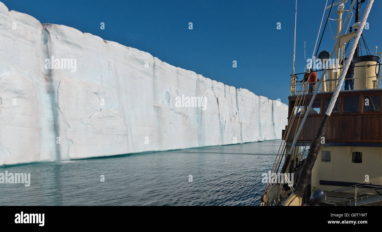 Our ship, MS Stockholm passing in front of the Ice cliffs on the edge ...