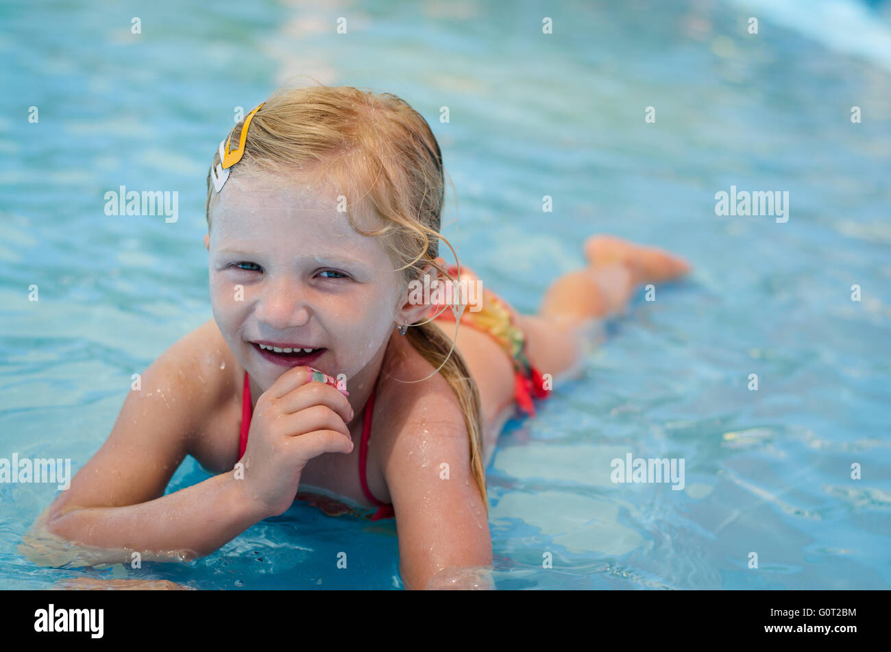 Girl lying in shallow water hi-res stock photography and images - Alamy