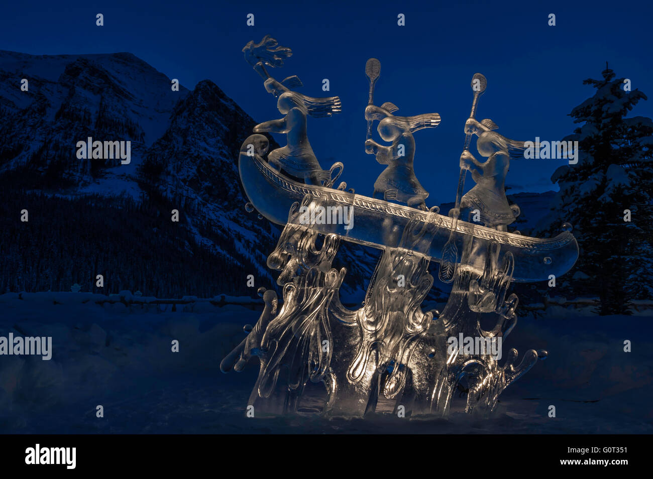 Ice sculpture of indigenous people in a canoe, Lake Louise, Banff ...