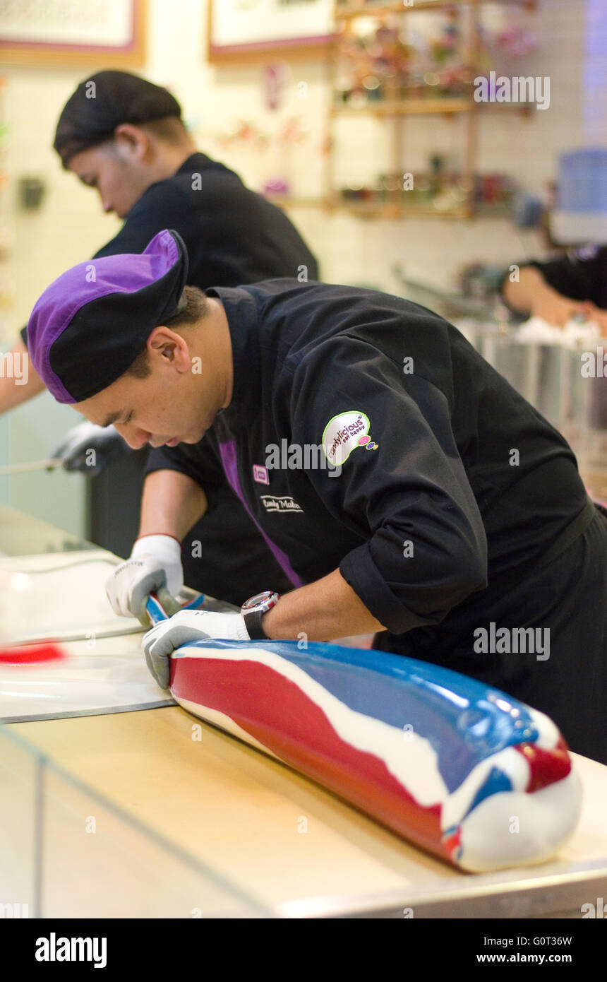 Employees in the Candylicious store in Dubai Mall making sweets for ...