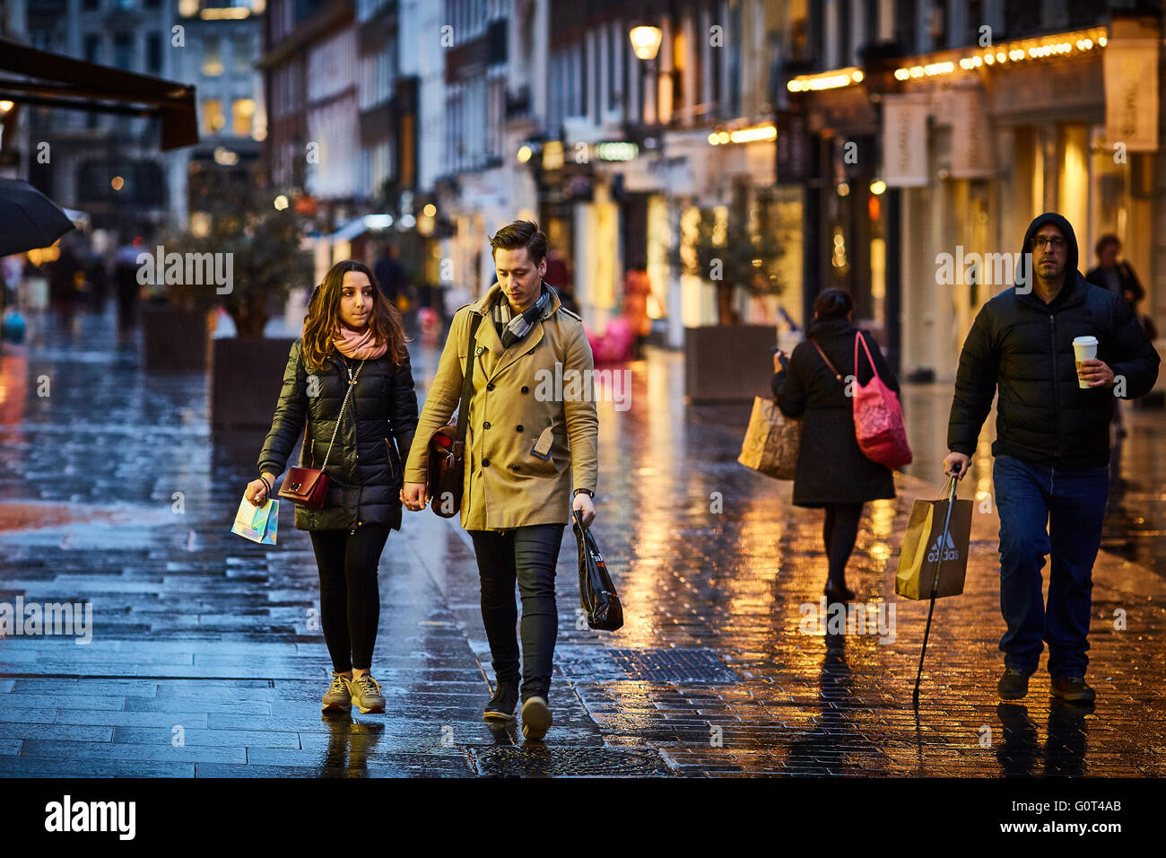 People Walking On Street At Night