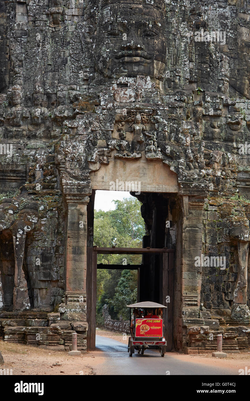 Tuk tuk going through Victory Gate, Angkor Thom (12th century temple ...