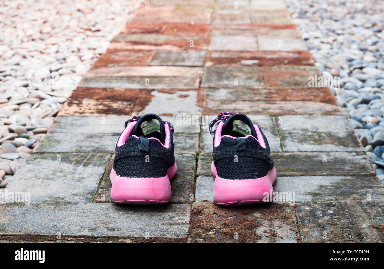 Running shoes in home garden foot path, stock photo Stock Photo - Alamy