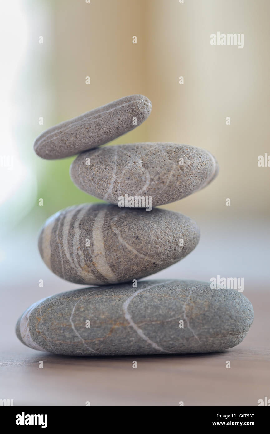 Balanced stack of pebbles isolated Stock Photo - Alamy