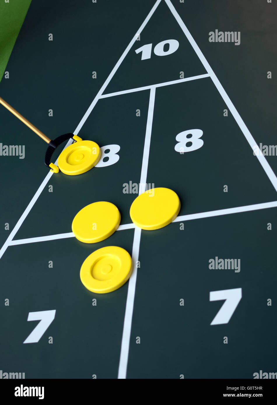 Court for shuffleboard with yellow discs Stock Photo - Alamy