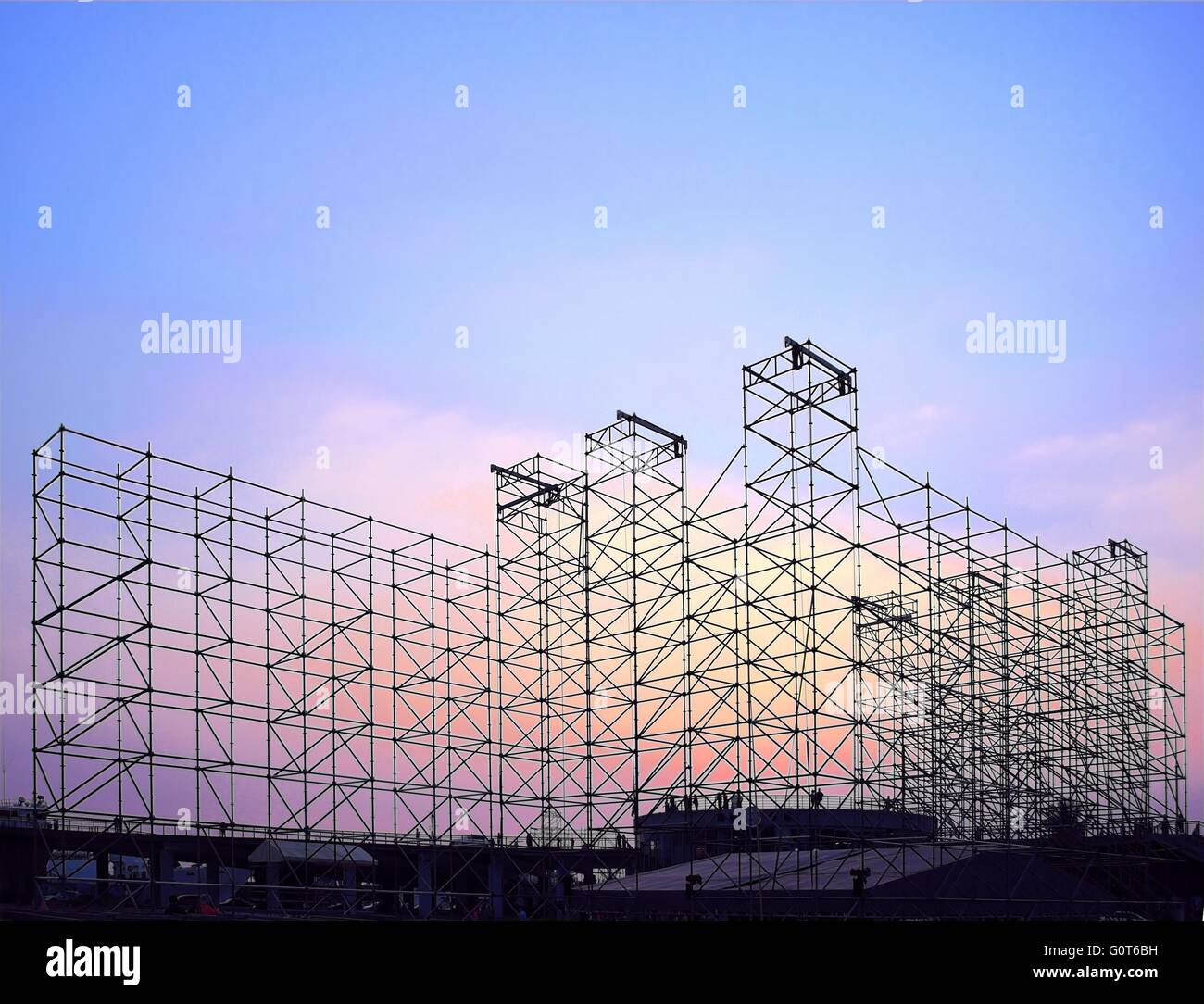 Complex scaffolding setup for a stage for an outdoor concert seen at ...