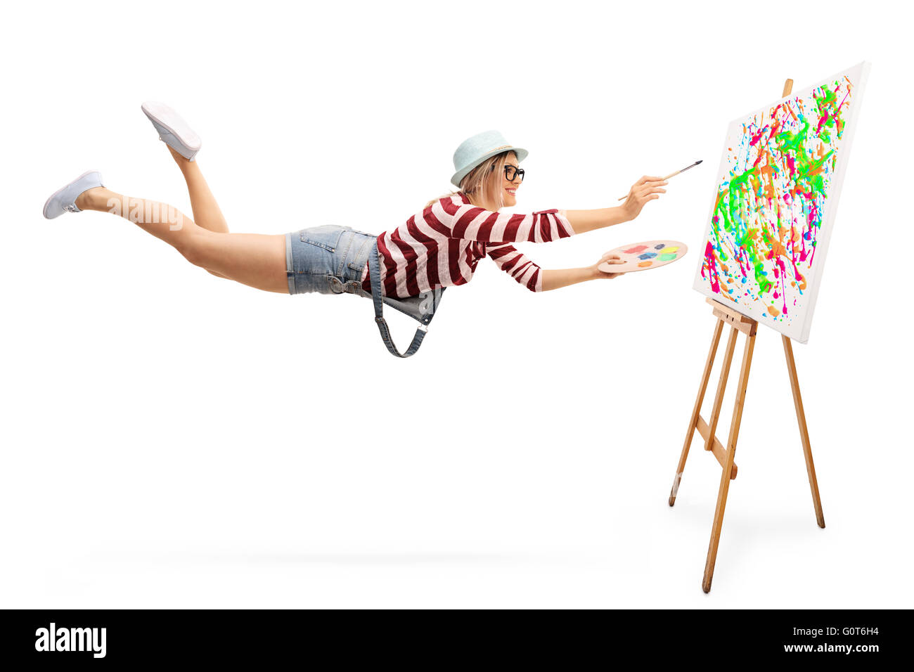 Flying female painter drawing a painting isolated on white background ...