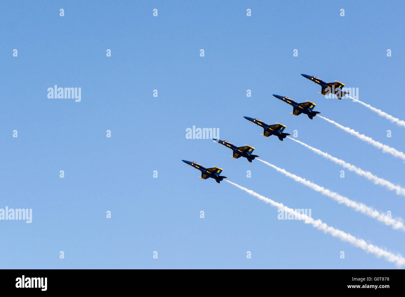 The Blue Angels fly in formation in a clear sky during fleet week in ...