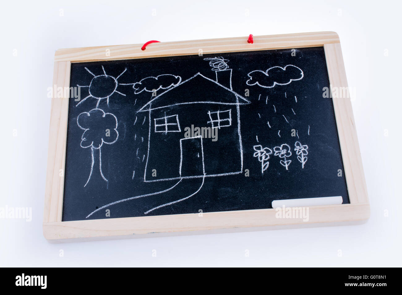 Hand drawing a house on the blackboard with a chalk Stock Photo - Alamy