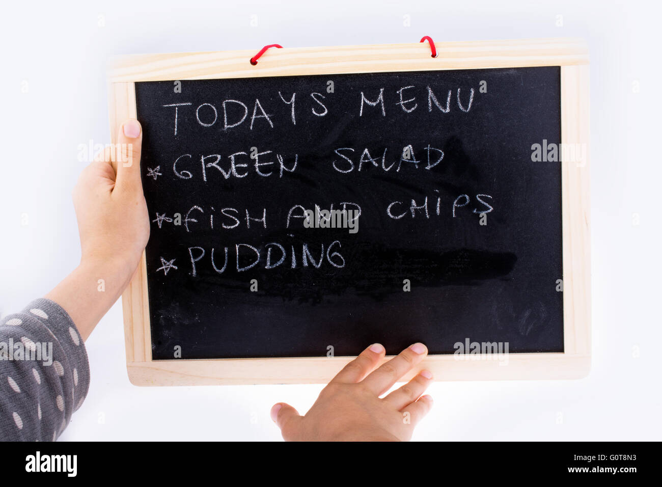 Hand holding the board with the menu of the day written with chalk ...