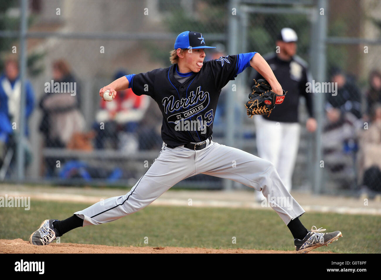 Right-handed pitcher delivering a pitch to a waiting hitter during a ...
